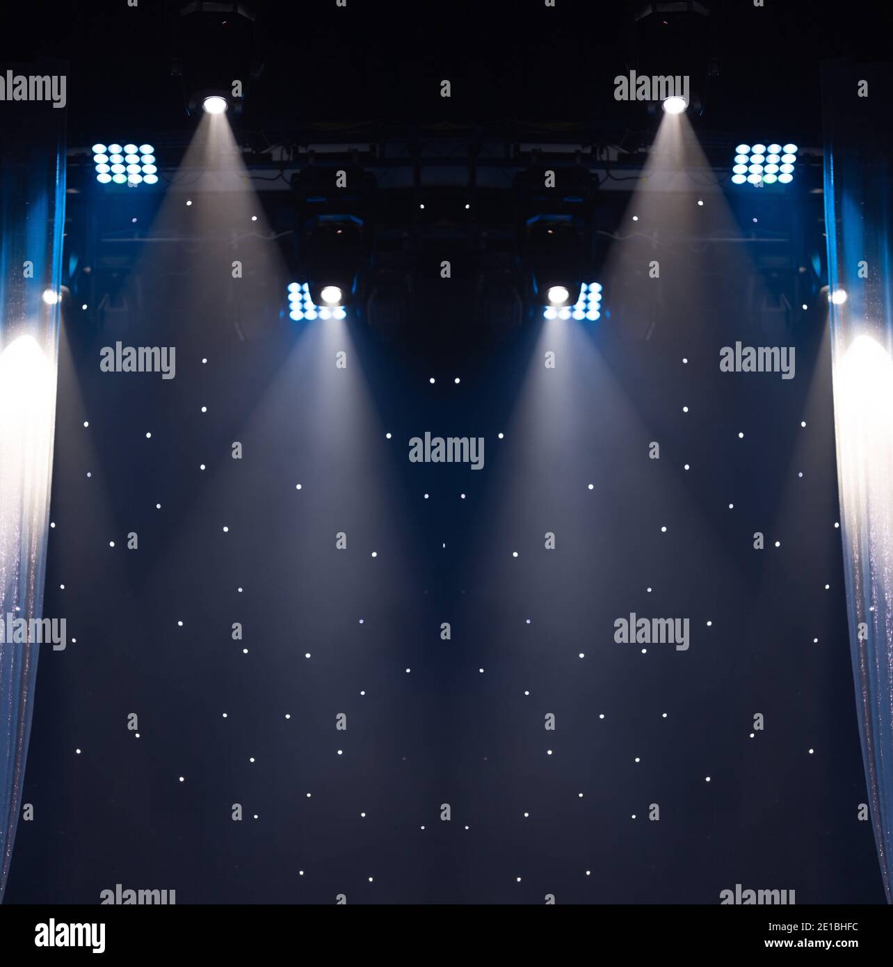 The stage of the theater illuminated by spotlights from the auditorium ...