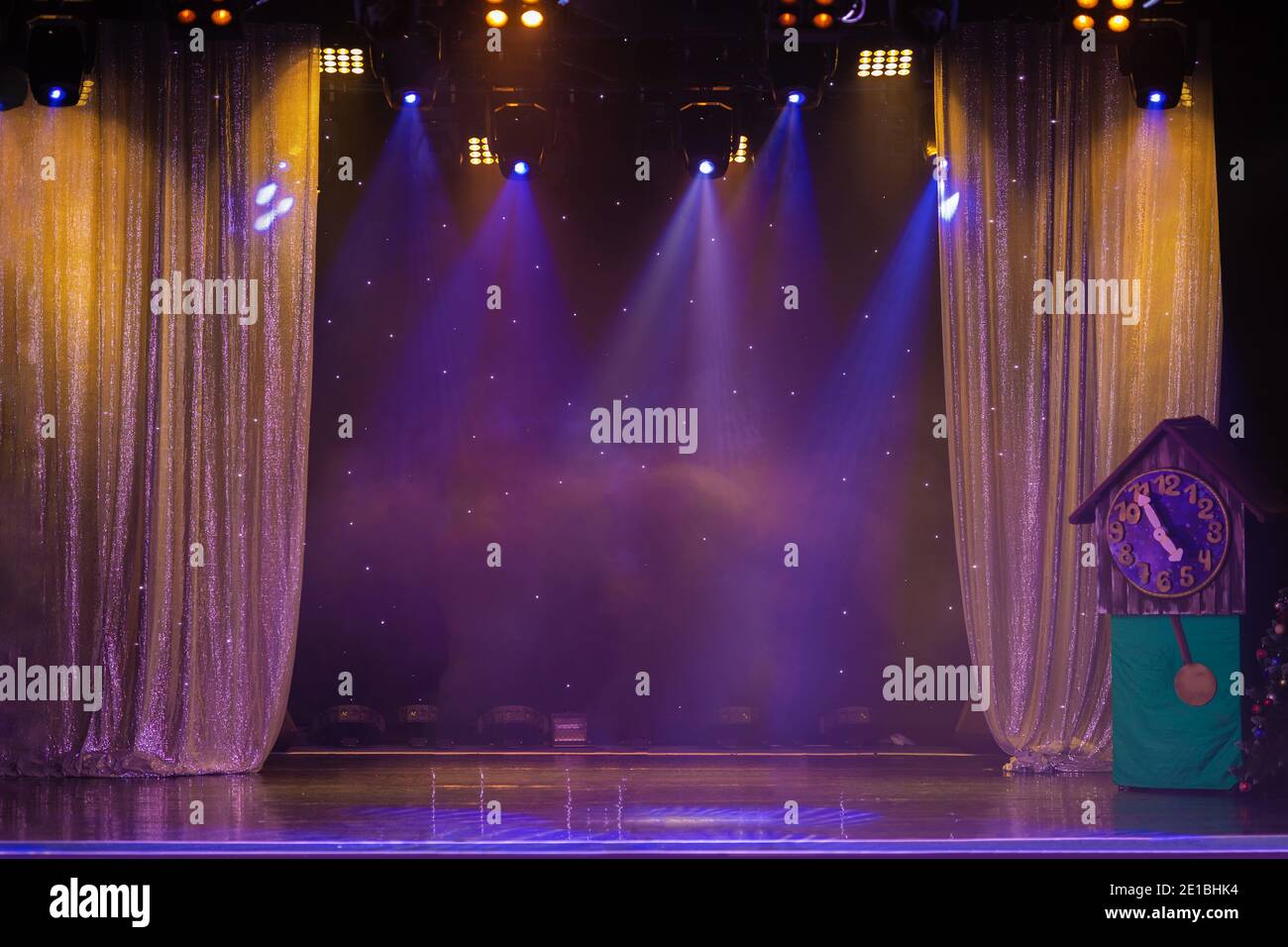 An empty stage of the scene concert hall, lit by spotlights and smoke ...