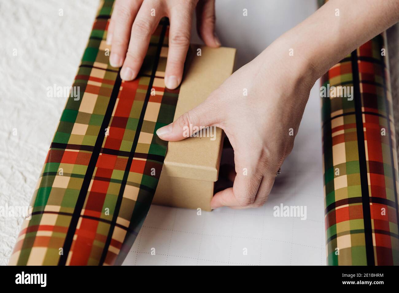 hands wrapping presents with paper Stock Photo - Alamy