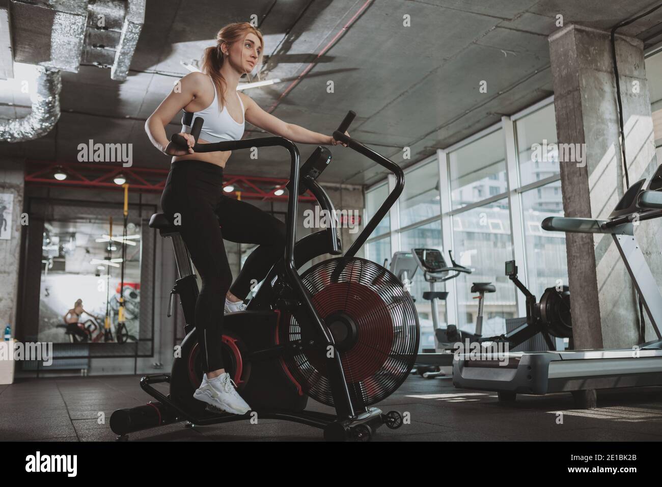 Woman exercise bike gym intense hi-res stock photography and images - Alamy
