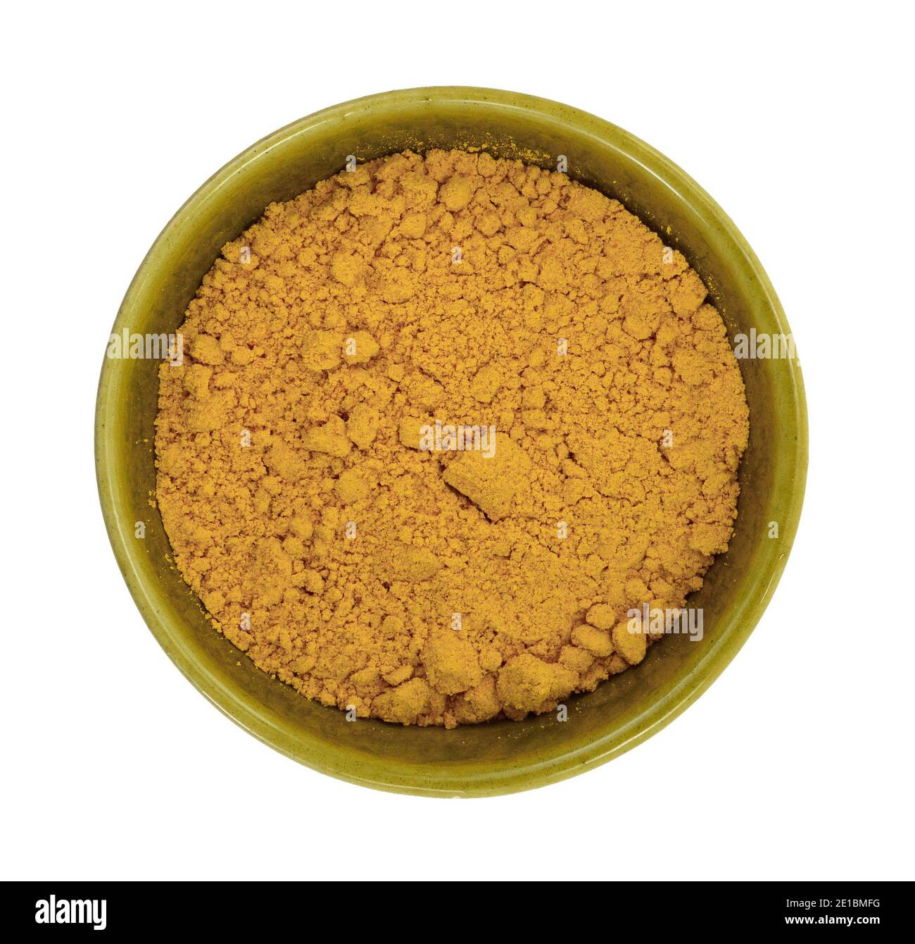 Turmeric, curcuma powder in a green bowl isolated on white background ...