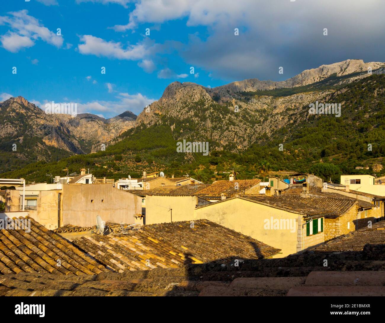 View over rooftops towards the Serra de Tramuntana mountains at Soller ...