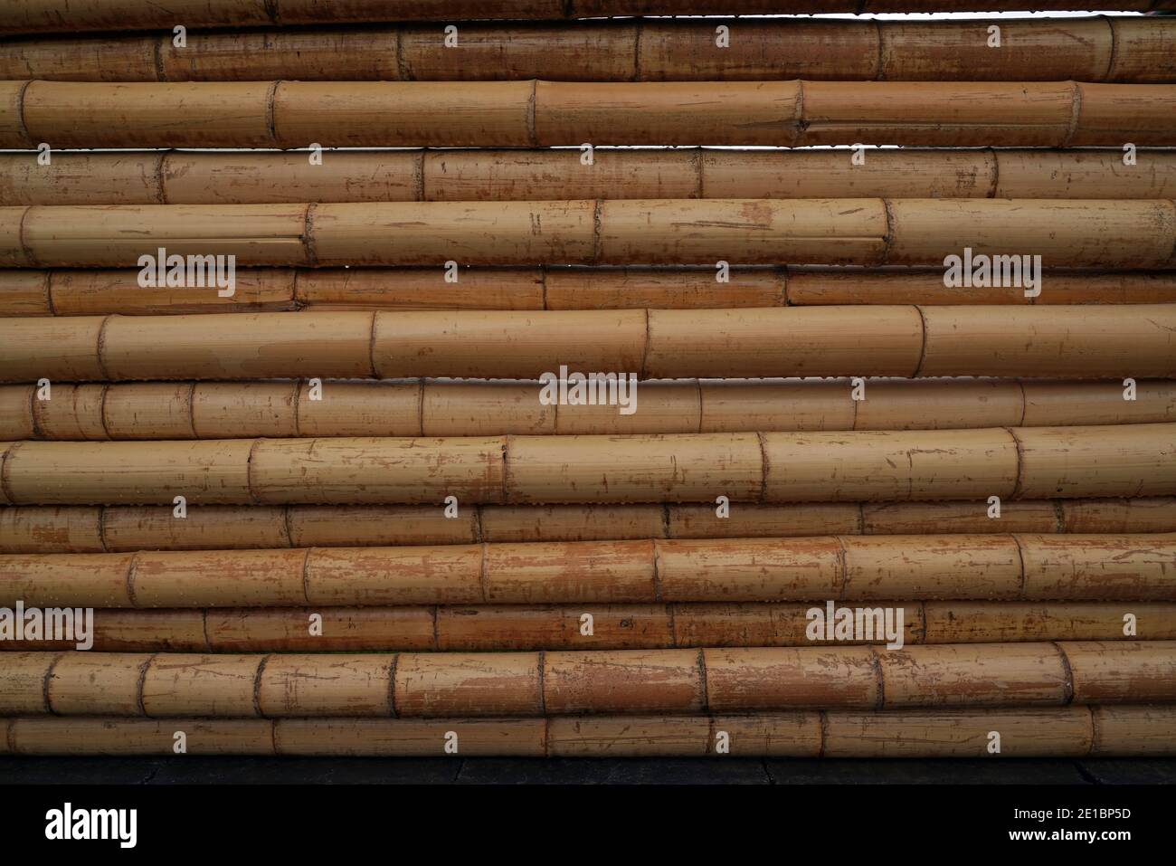 Fence made from bamboo pipes Stock Photo - Alamy