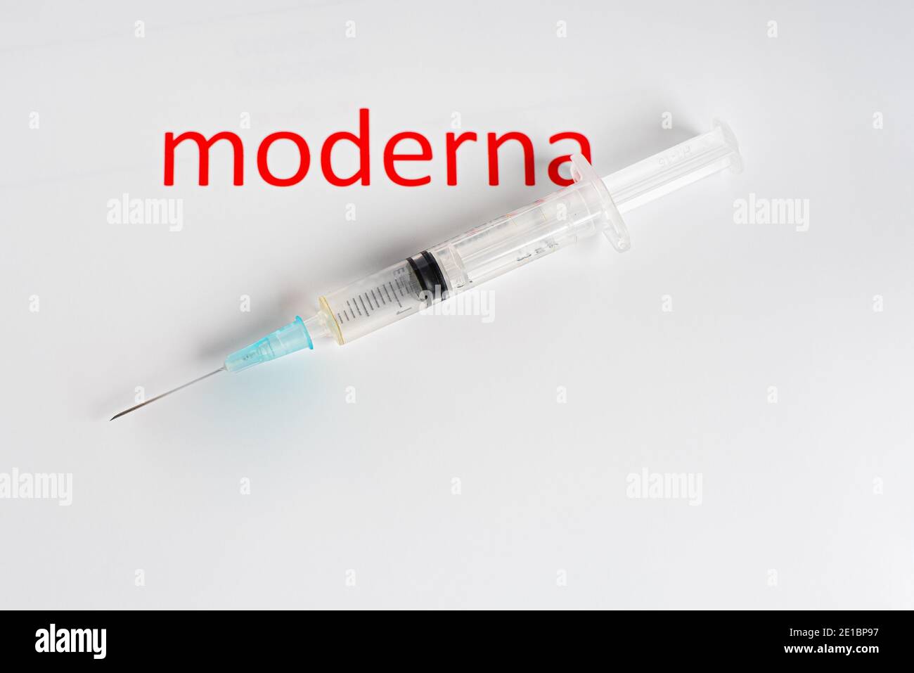 Syringe and moderna sign on white background, Denmark, December 19 ...