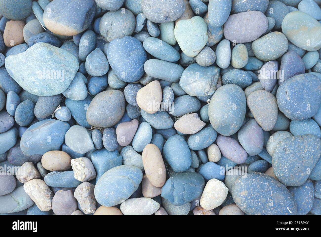 Pebbles stone background with vintage filter Stock Photo - Alamy