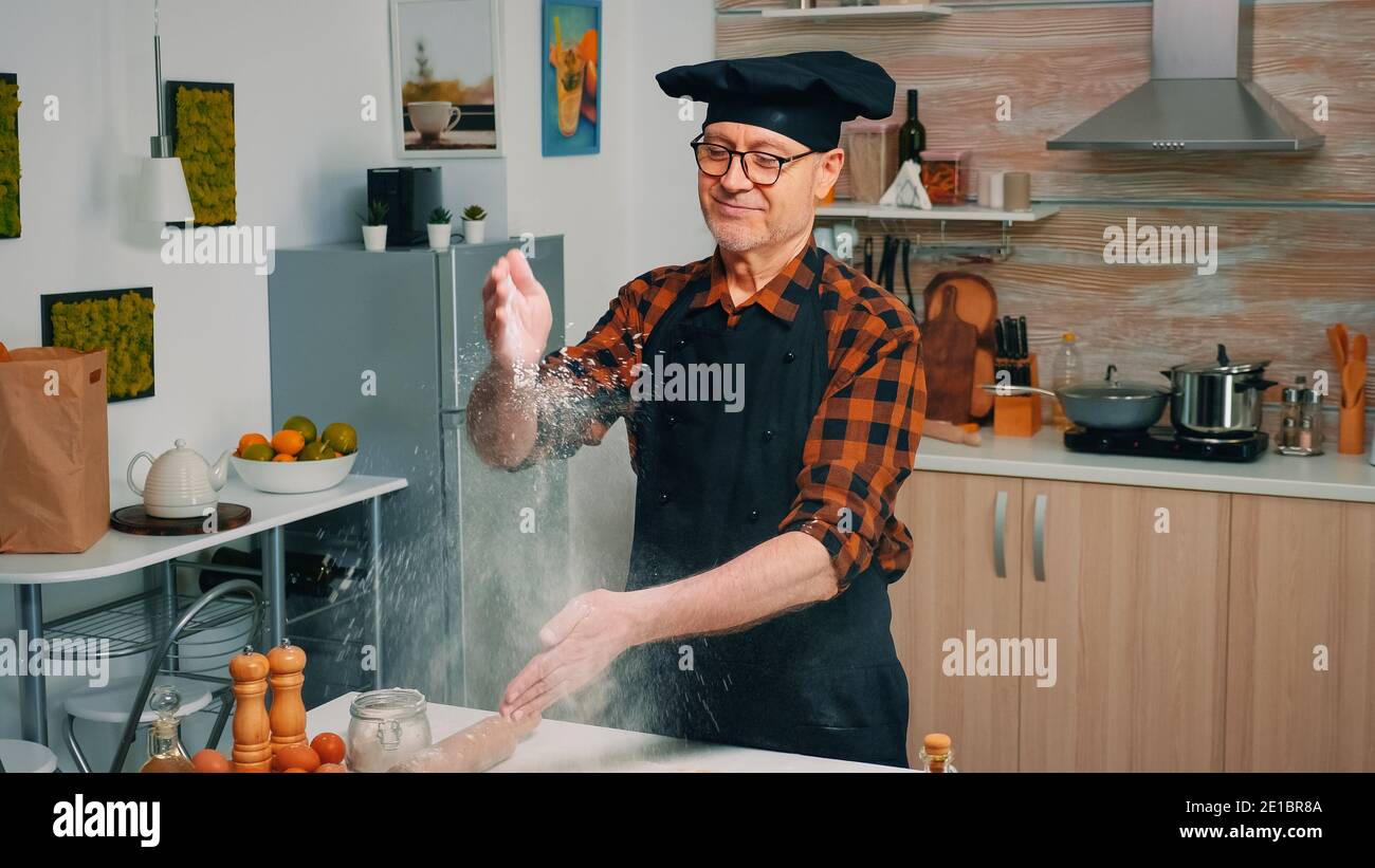 Professional chef claps hands flour hi-res stock photography and images ...