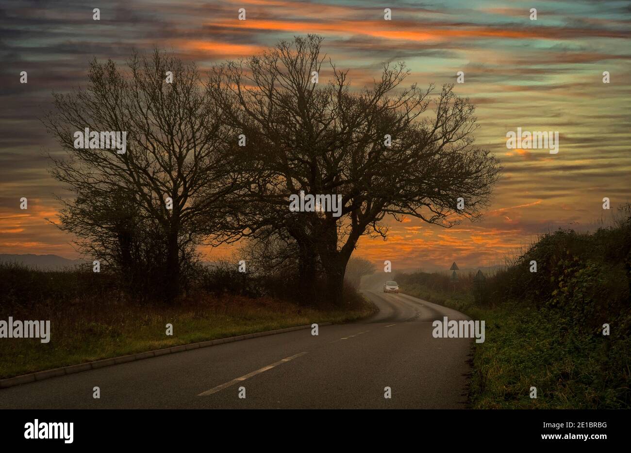 Dawn Landscape with car Stock Photo - Alamy