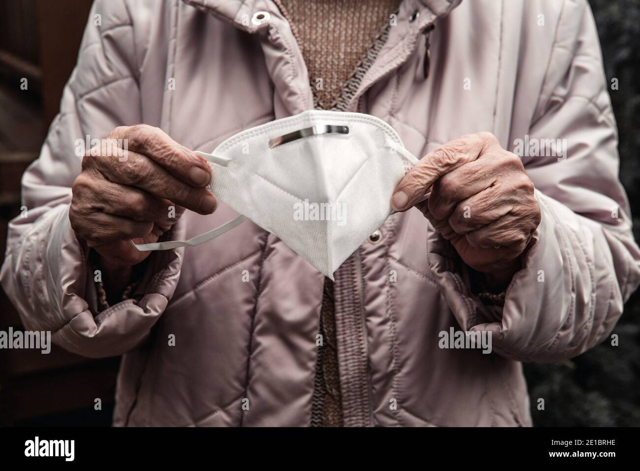 Hands holding face mask hi-res stock photography and images - Alamy