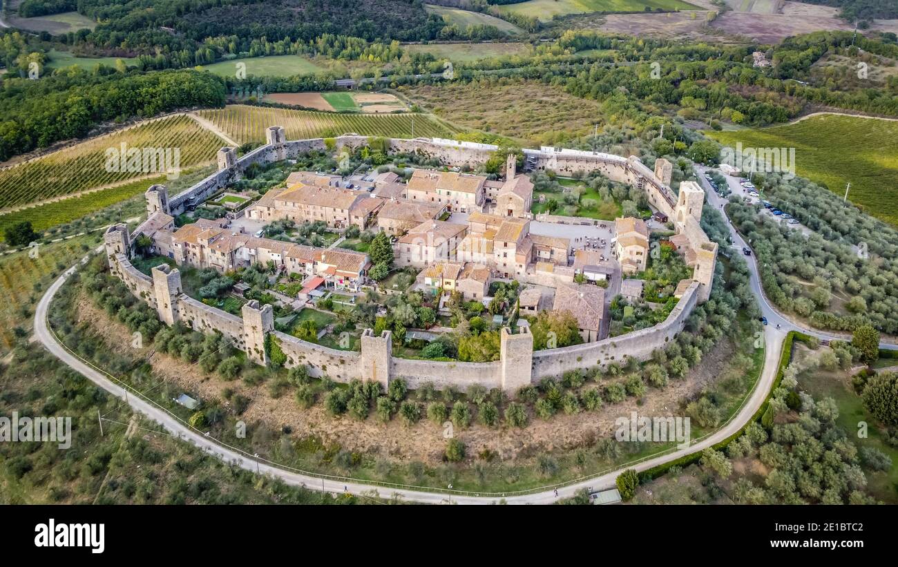 aerial view of the medieval village of Monteriggioni rises at the south ...