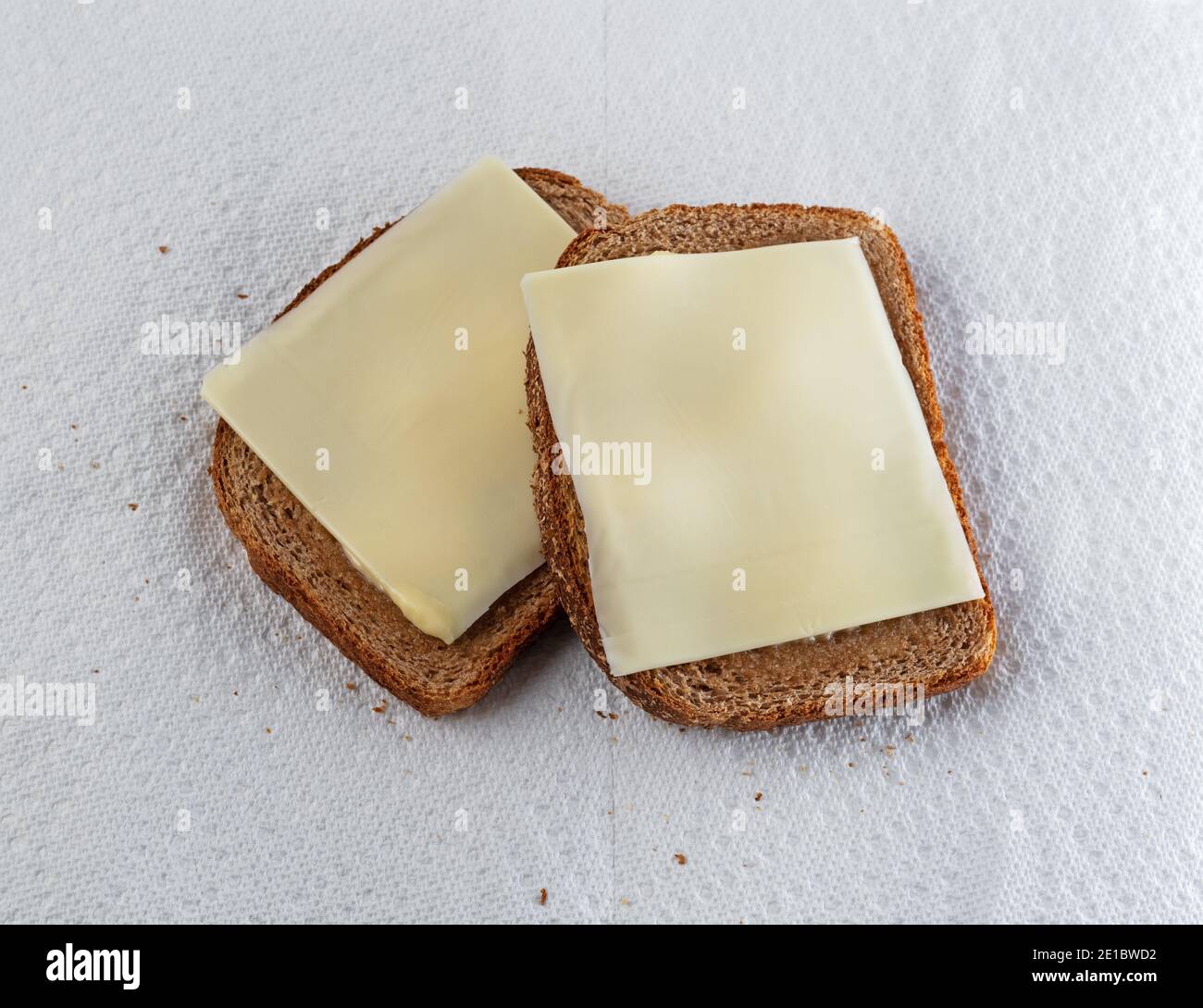 Overhead view of two slices of lightly toasted wheat bread with ...