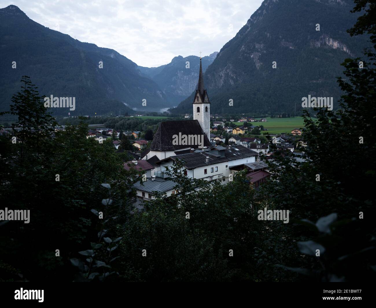Panoramic view of traditional alpine village with parish church Golling ...