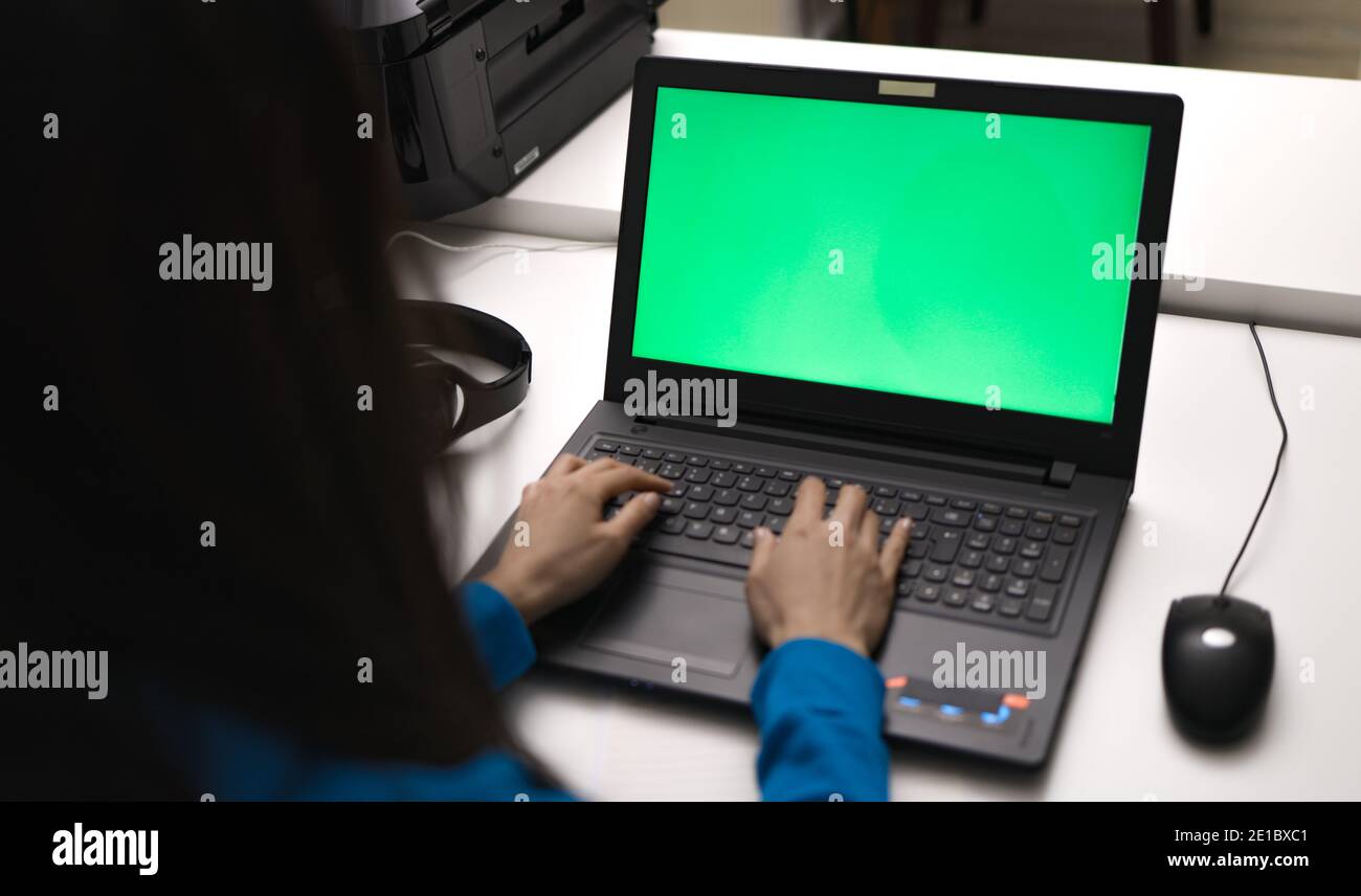 Working with a laptop - green screen shot Stock Photo - Alamy