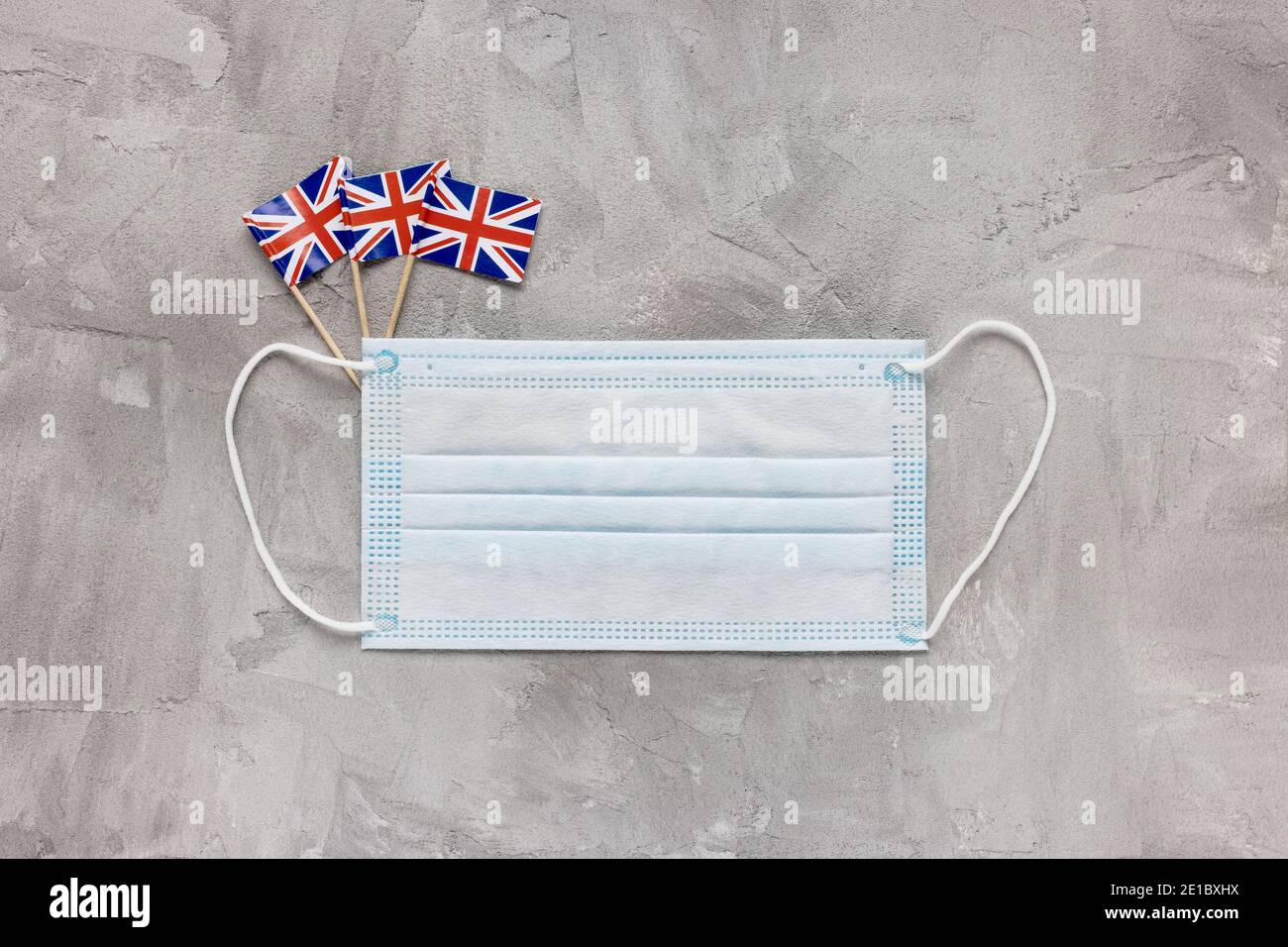 White medical face masks and UK flags Stock Photo - Alamy