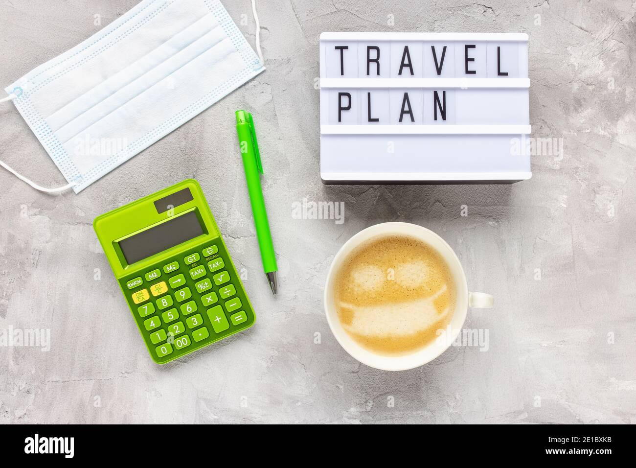 Face mask, calculator, pen and text TRAVEL PLAN Stock Photo - Alamy