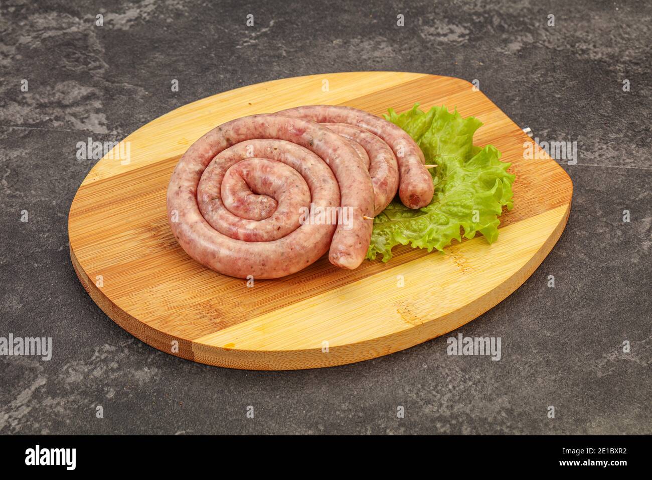 Raw pork sausage ring for grill Stock Photo - Alamy