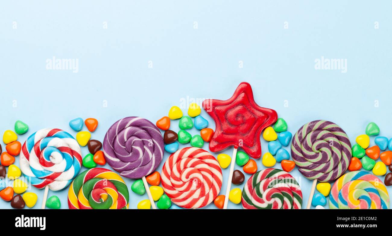 Various candy sweets and lollipop. Top view flat lay with copy space ...
