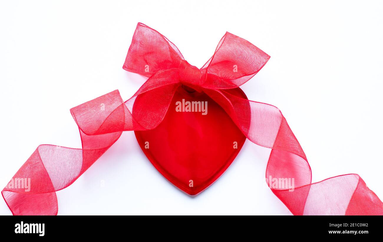 Valentine's day, love, romantic concept. Red heart, bow and ribbon on a ...