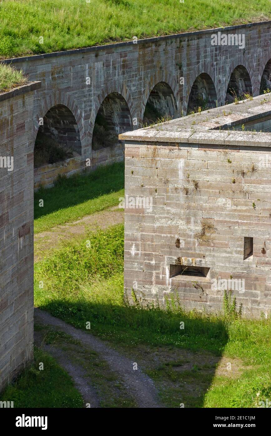 Moat and a fortified wall in an old fortress Stock Photo - Alamy