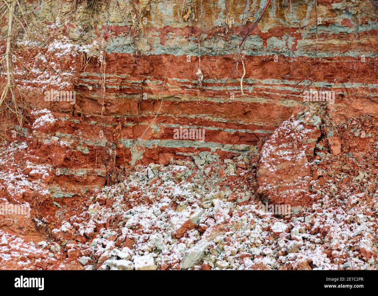 Textured red and white clay outcrop in the sea cliffs. Sandstones and ...