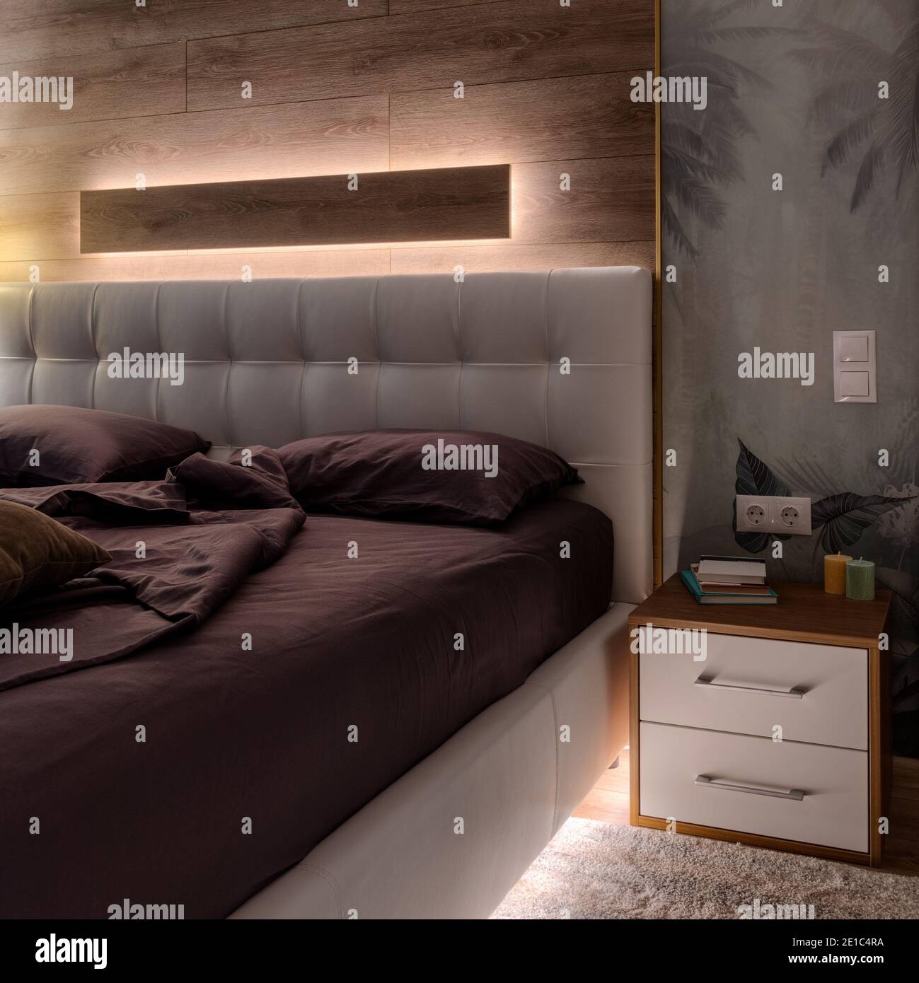 Modern bedroom at night, double bed with nightstand with books Stock ...