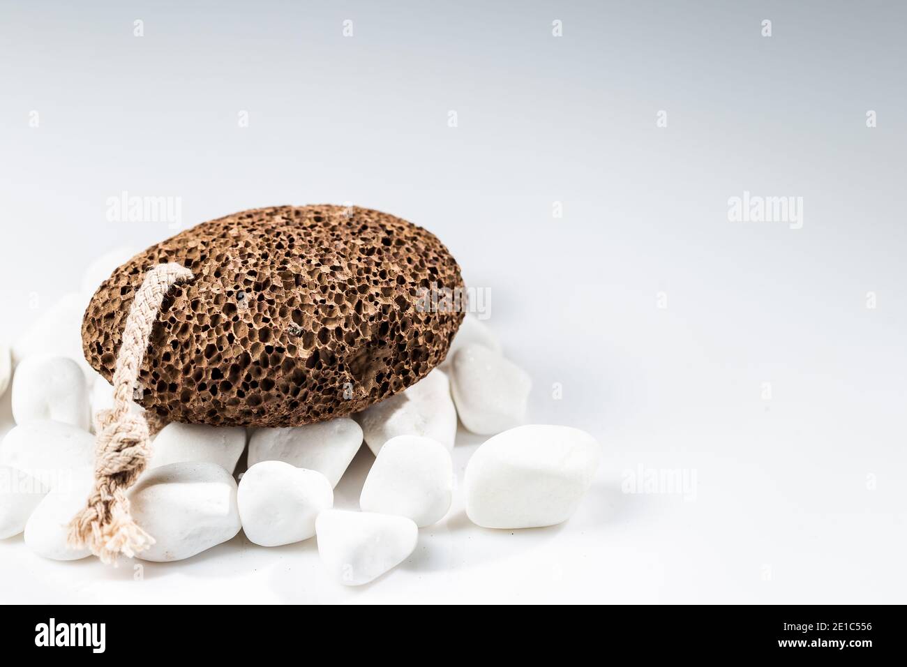 Brown pumice stone for home spa over white background Stock Photo - Alamy