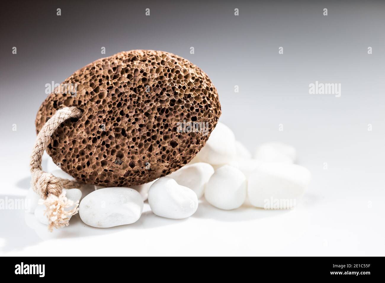Brown pumice stone for home spa over white background Stock Photo - Alamy