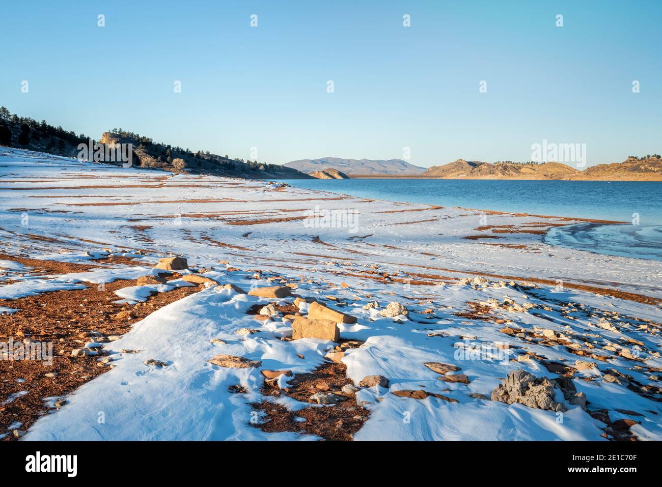 winter scenery of mountain lake at foothills of Rocky Mountains in ...