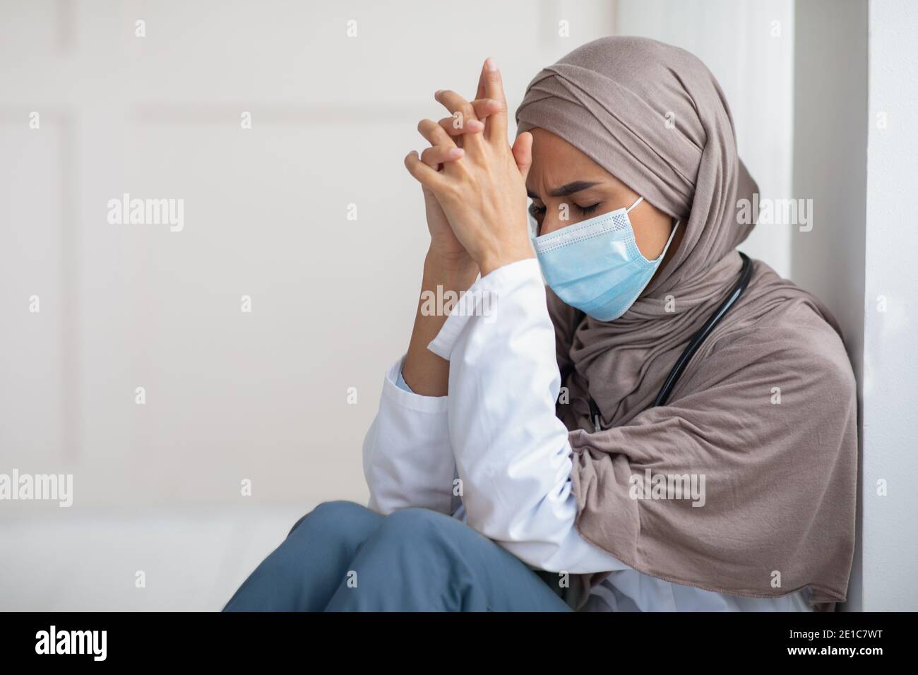 Tired muslim woman doctor having short break during working shift Stock ...