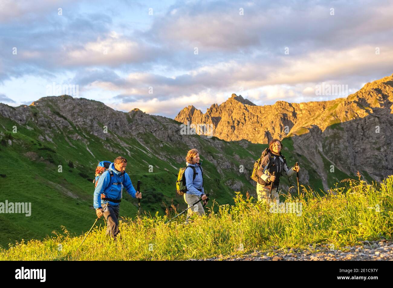 Three Hikers doing a tour in early morning hours Stock Photo - Alamy