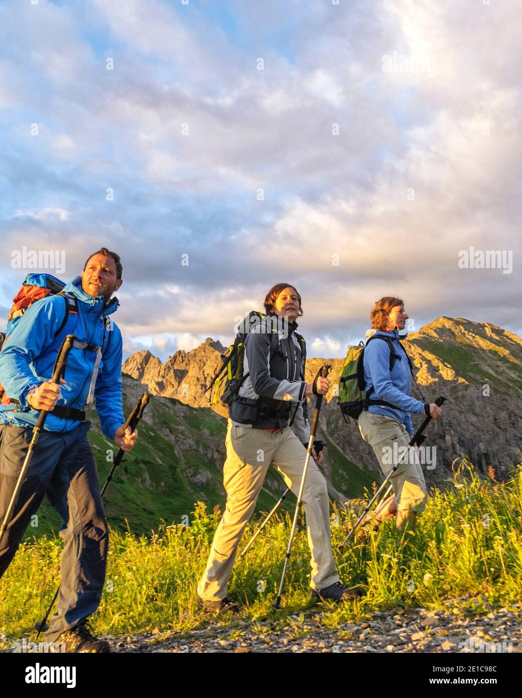Three Hikers doing a tour in early morning hours Stock Photo - Alamy