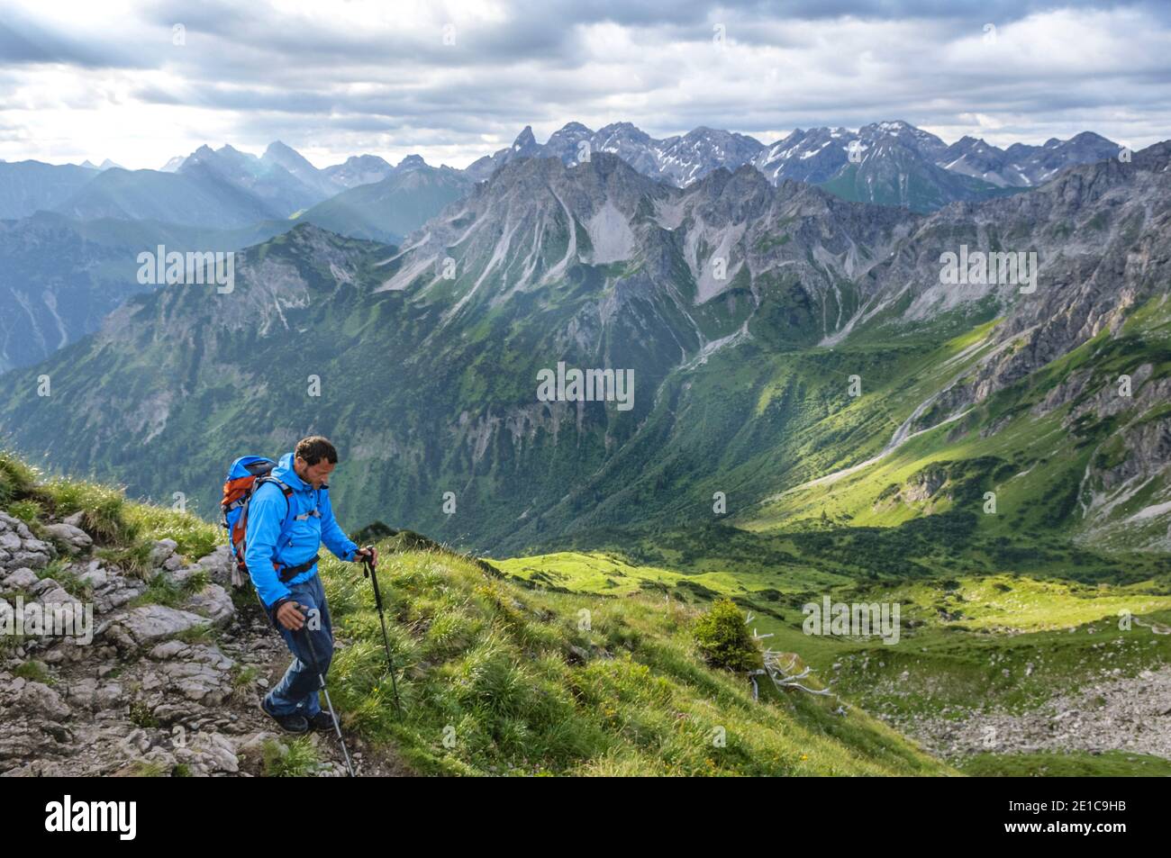 Hikers on the way in the early morning sun Stock Photo - Alamy
