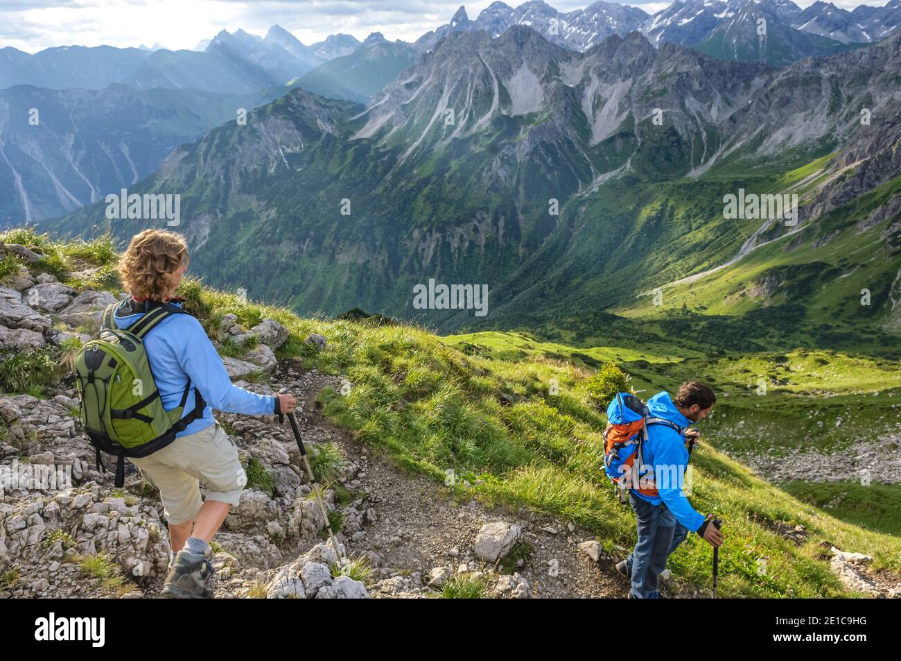Hikers on the way in the early morning sun Stock Photo - Alamy