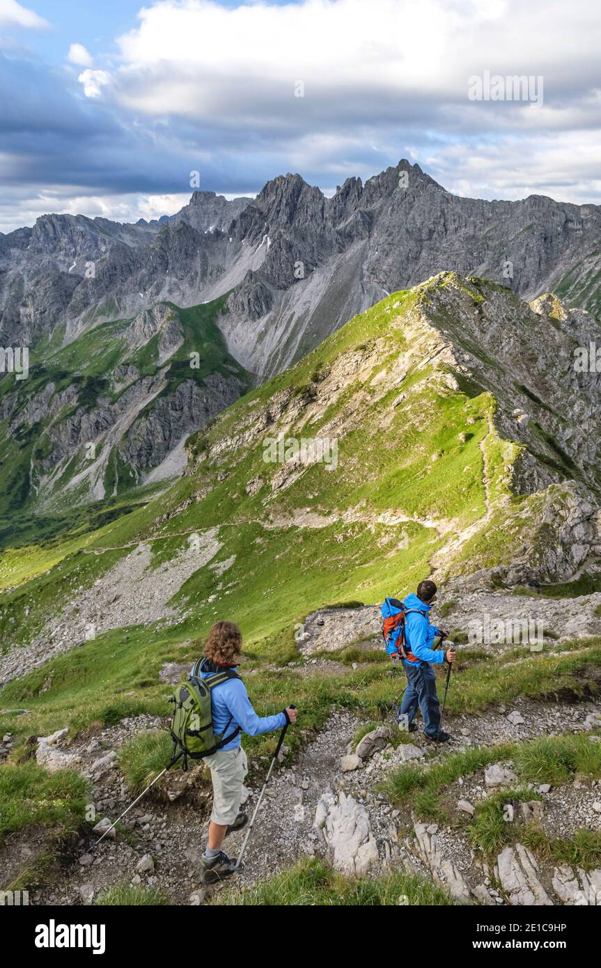 Hikers on the way in the early morning sun Stock Photo - Alamy