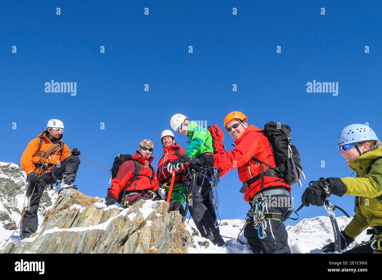 Group of alpinists on mountain top Stock Photo - Alamy