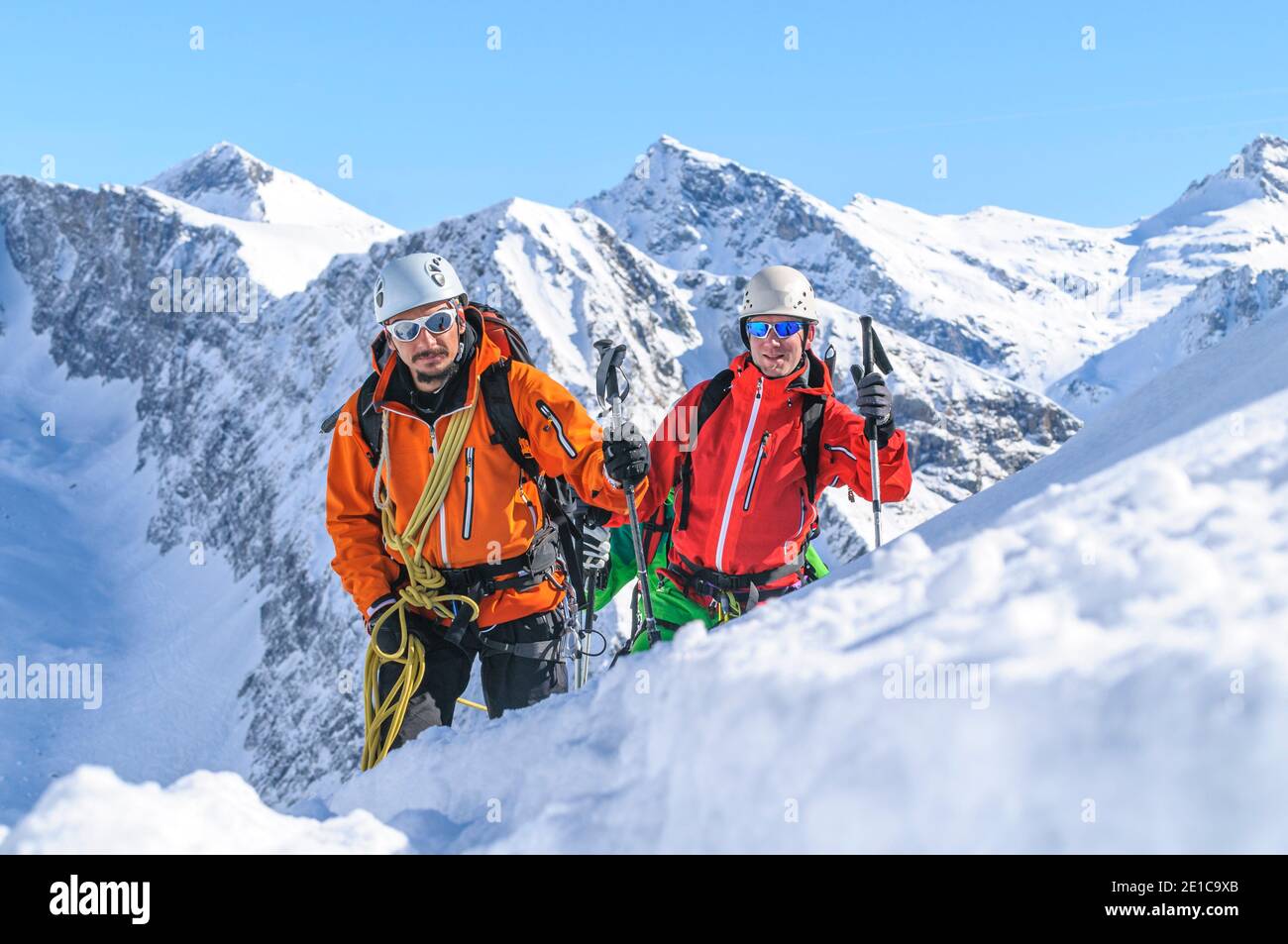 Mountain guide leading a group of alpinists up to Monte Rosa Glaciers ...