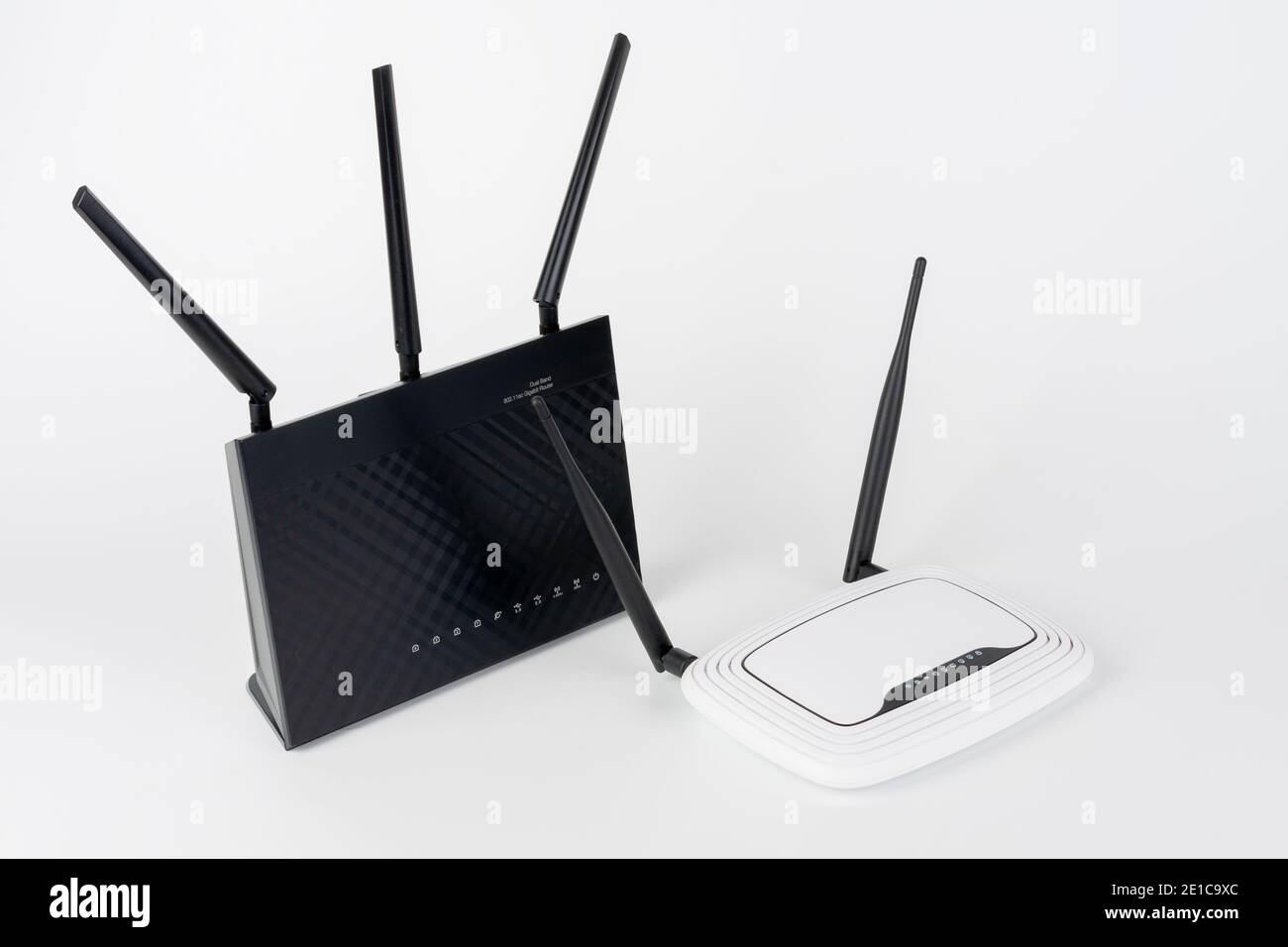 Two Wi-Fi routers, wireless devices with two and three antennas. Black ...