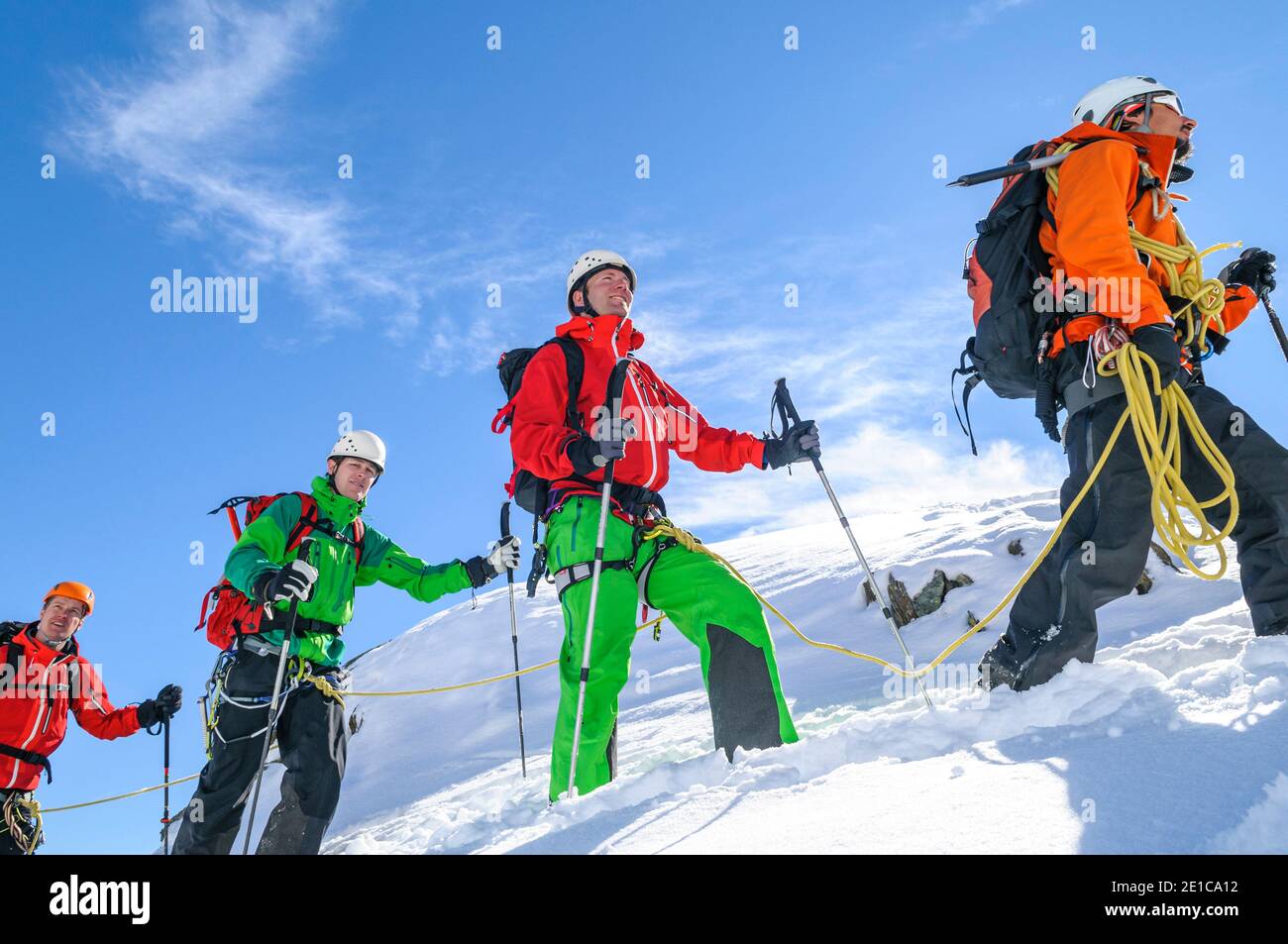 Mountain guide leading a group of alpinists up to Monte Rosa Glaciers ...