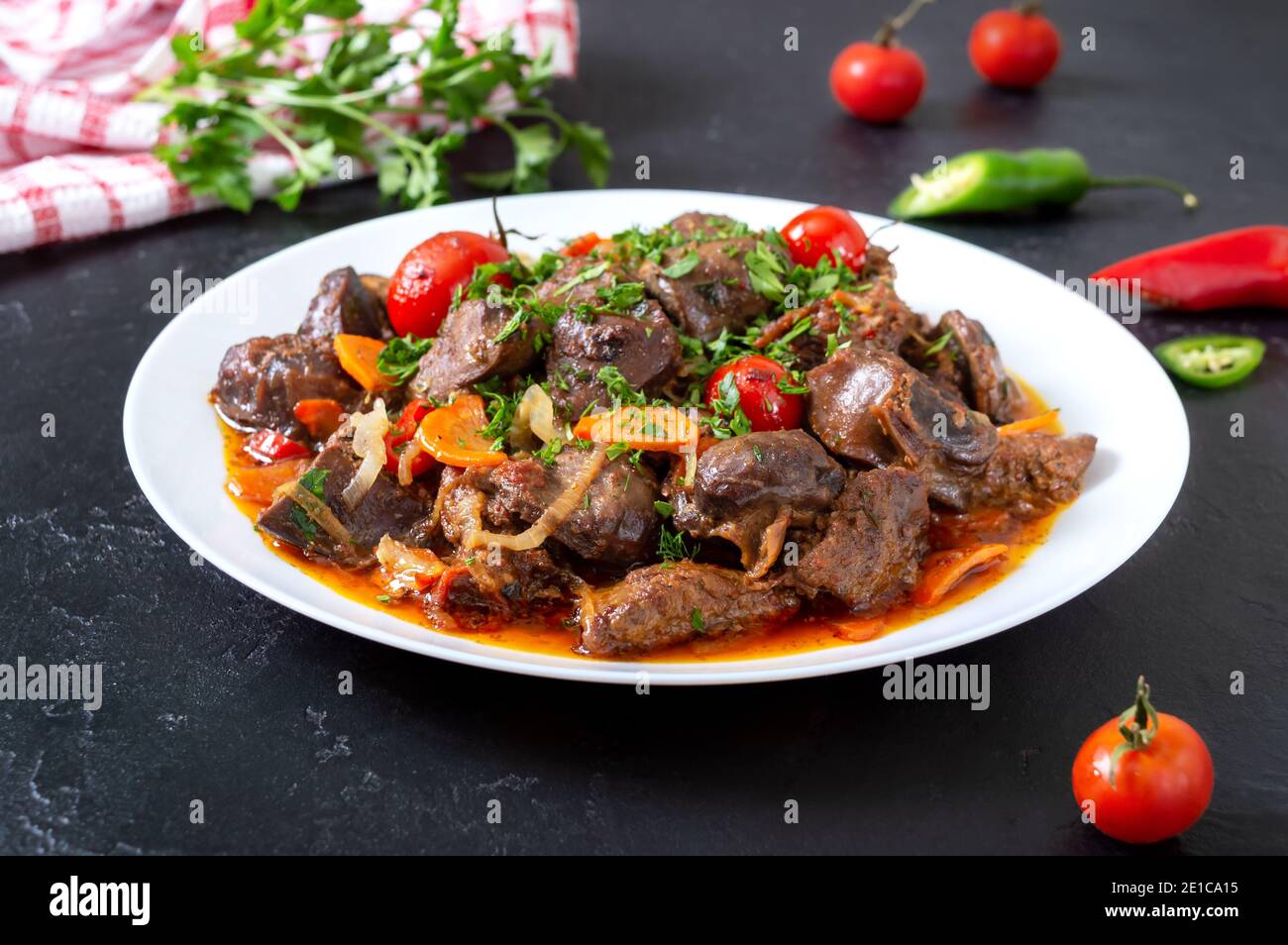 Roast offal with vegetables. Armenian dish Kuchmachi Stock Photo - Alamy