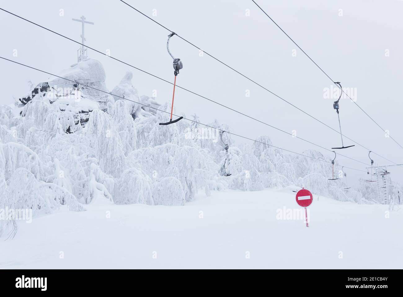 prohibitory road sign No entry against the background of an empty ski T ...