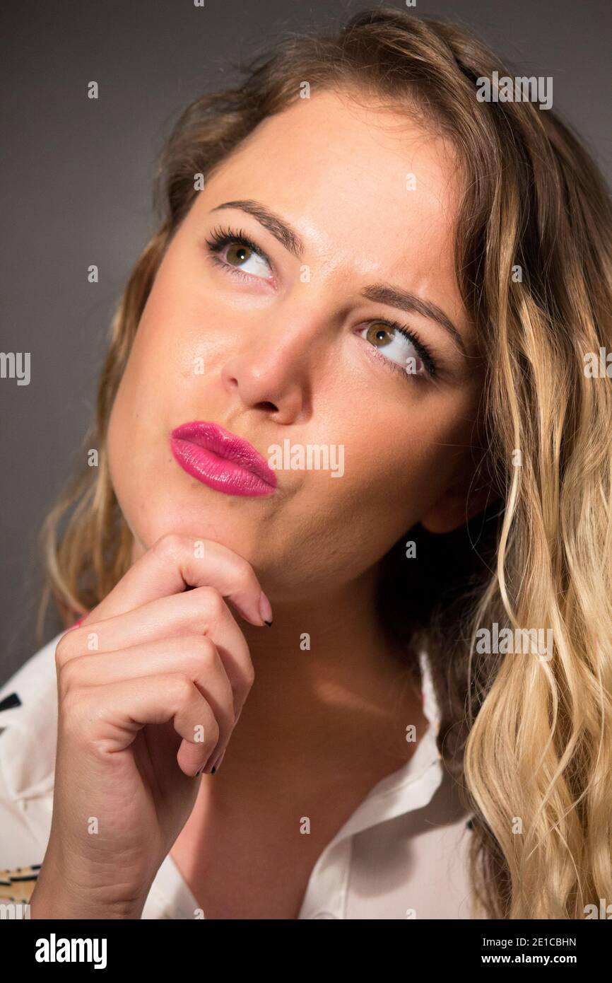 beautiful business women thinking Stock Photo - Alamy