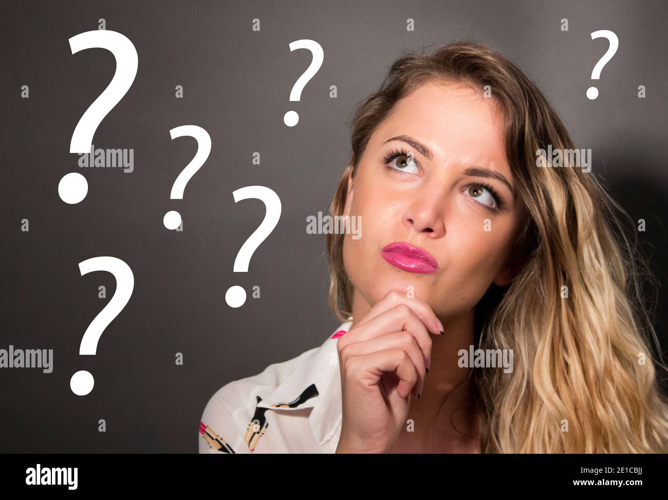 beautiful business women thinking Stock Photo - Alamy