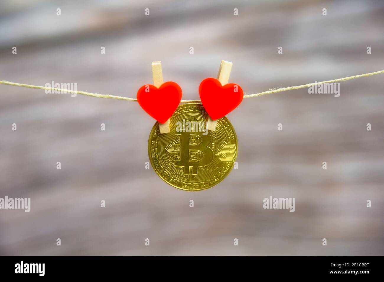 Bitcoin hanging with red heart isolated on white background.Coins for ...