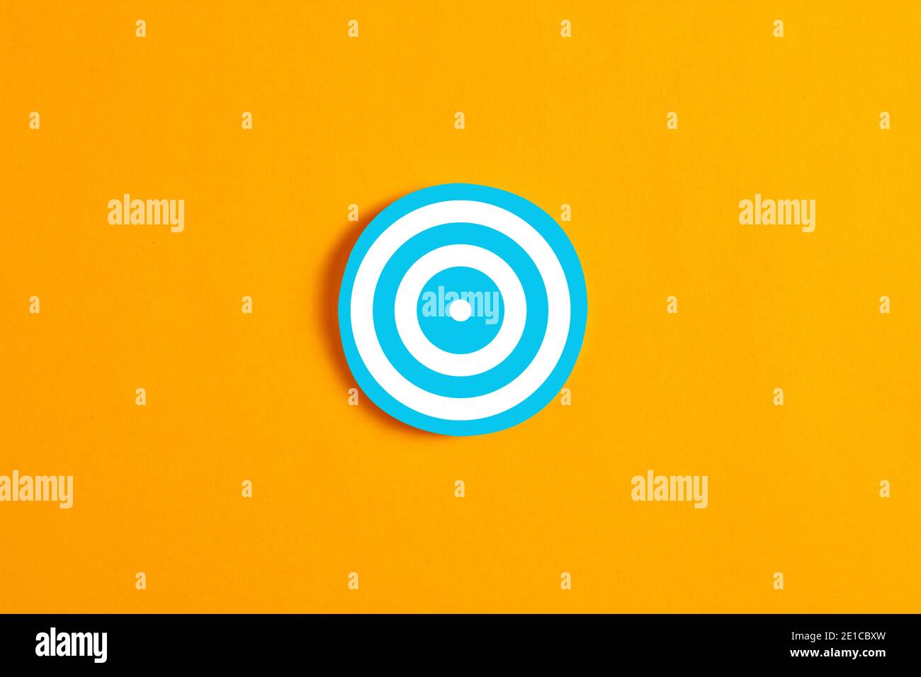 Blue round circle with a target icon against yellow background. Goal ...