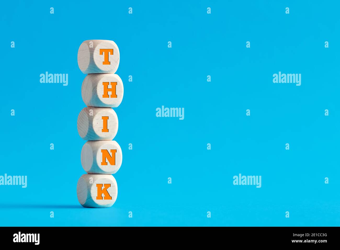 The word think on tiered wooden cubes on blue background. Thinking and ...