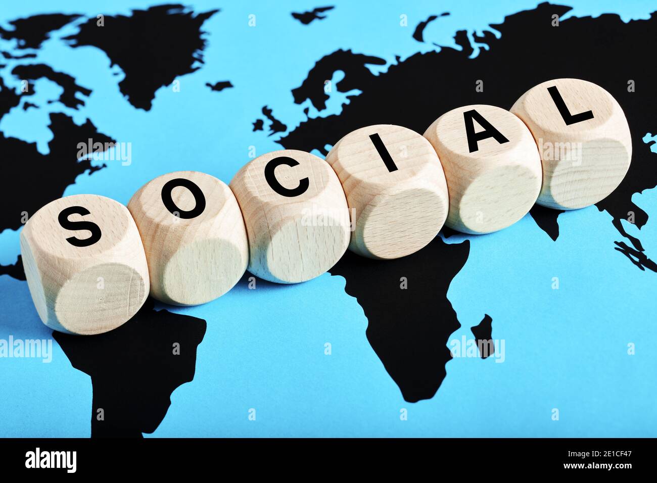 The word social written on wooden cubes on world map background. Social ...