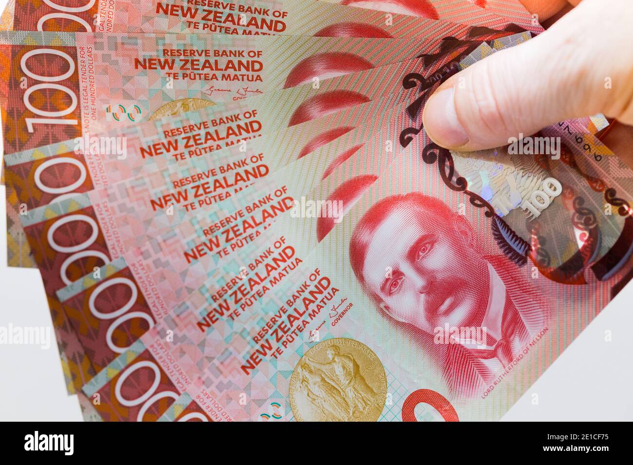 New Zealand money, A large amount of 100 dollar bills held in the hand ...