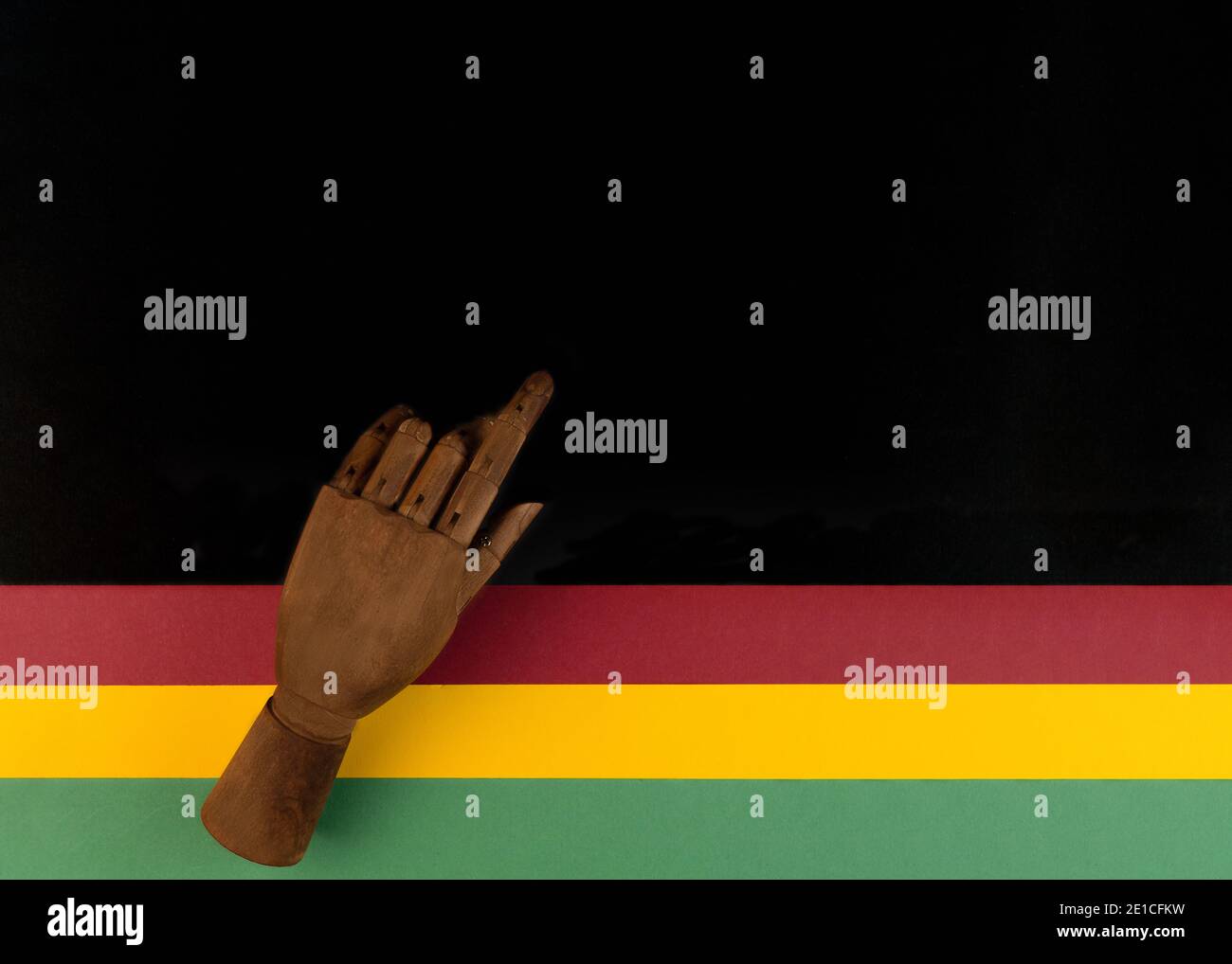 February Black History Month. Brown wooden hand on Paper geometric ...