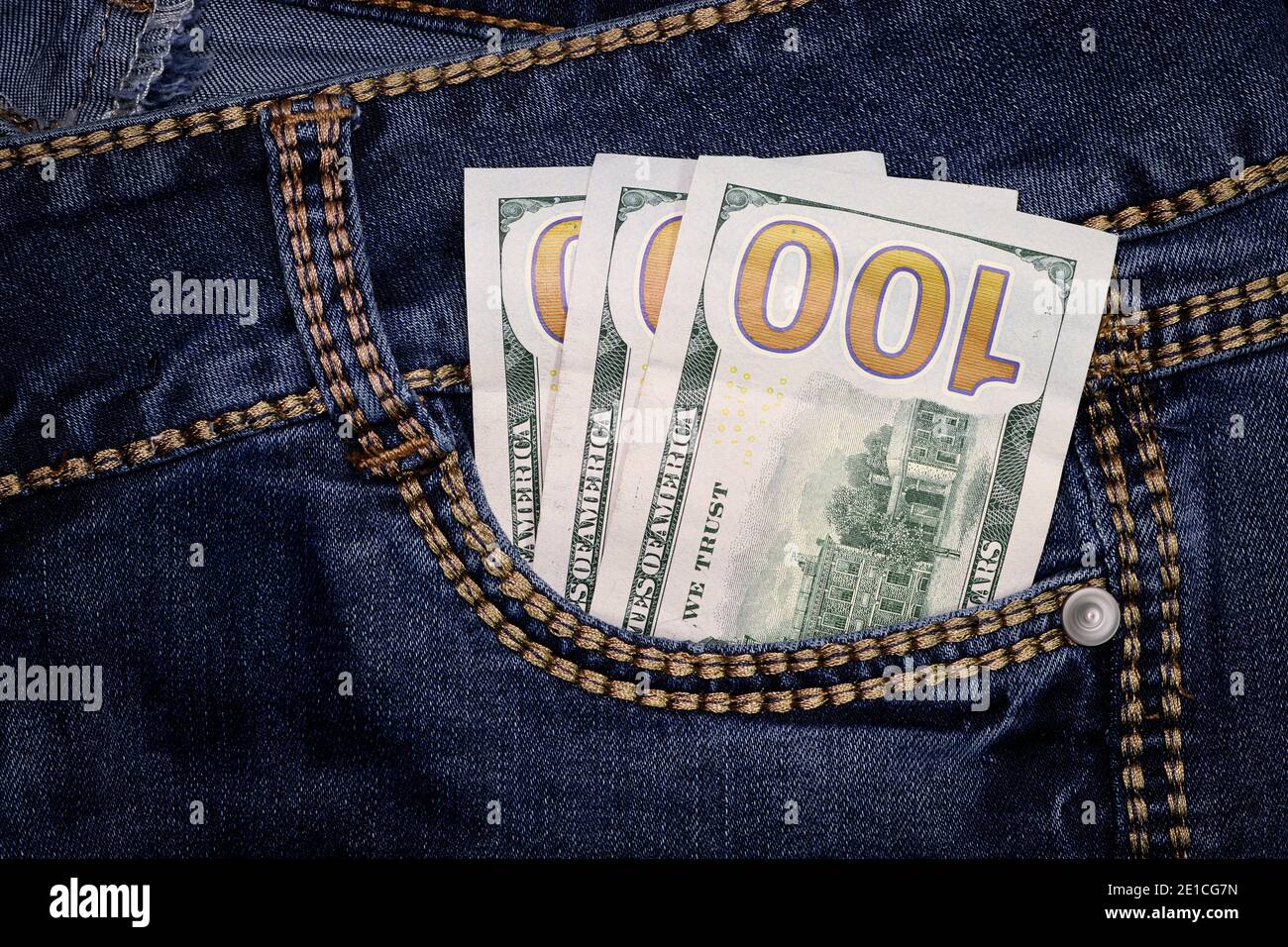 Stack of American hundred dollar bills in a pocket of blue jeans. Money ...