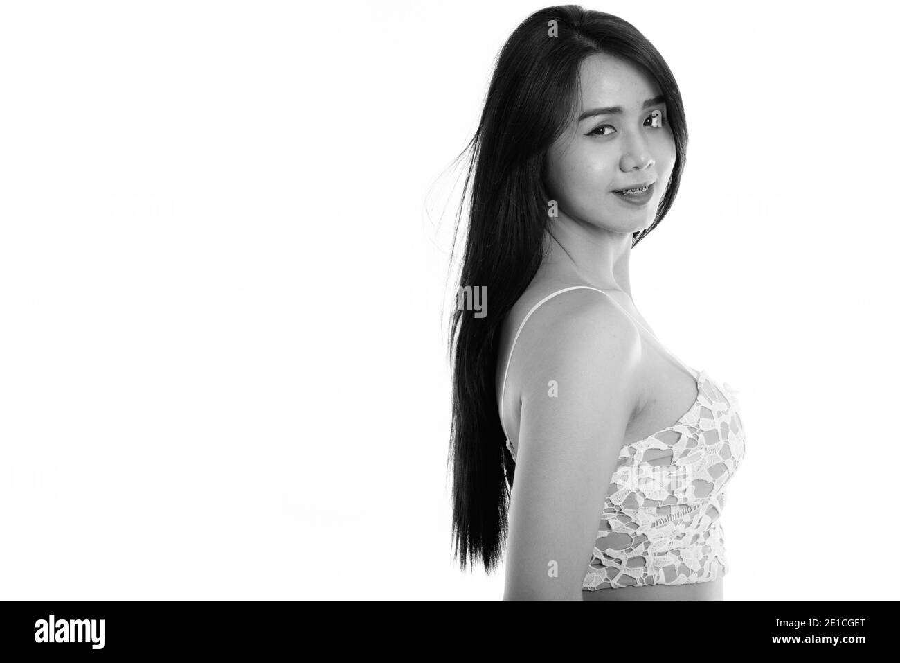 Studio shot of young happy Asian transgender woman smiling while ...