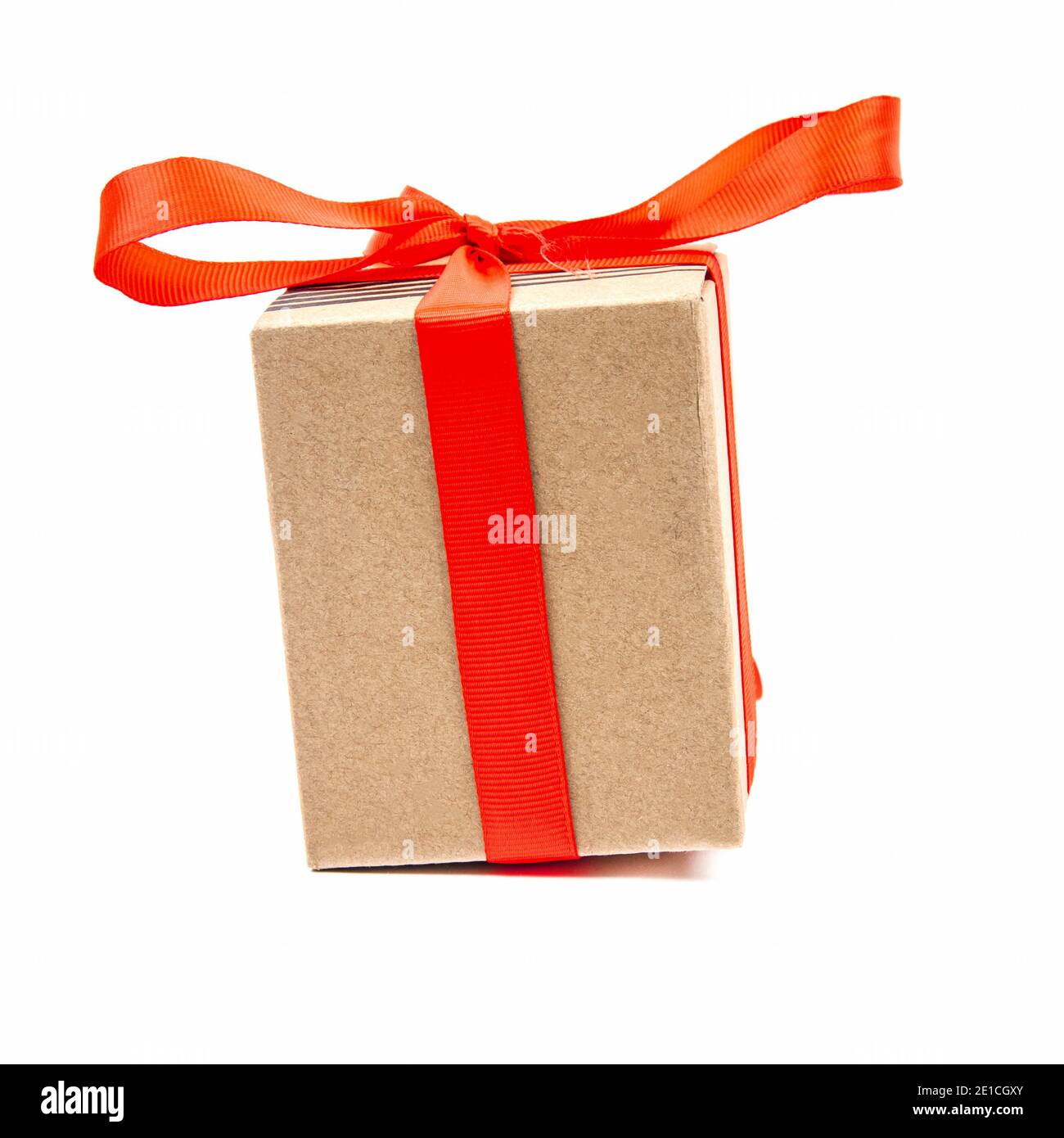 Square cardboard box tied with red ribbon isolated on a white ...